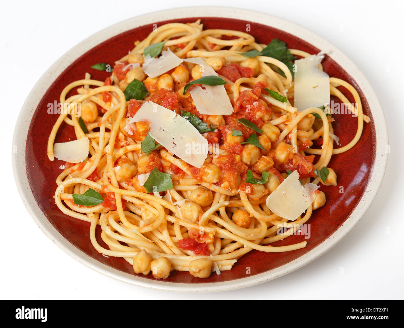 Spaghetti with a chickpea, tomato and chilli flakes sauce, garnished ...