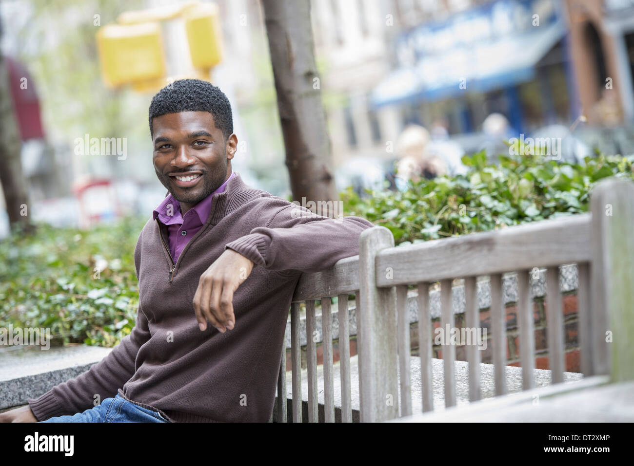 Seated on a bench hi-res stock photography and images - Alamy