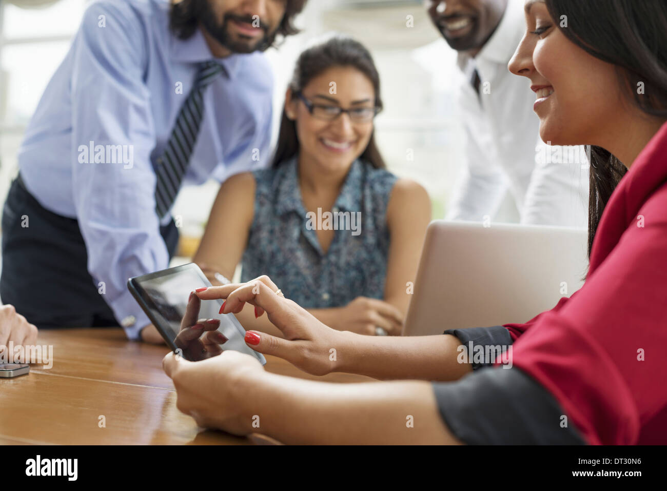 People working around a computer hi-res stock photography and images ...