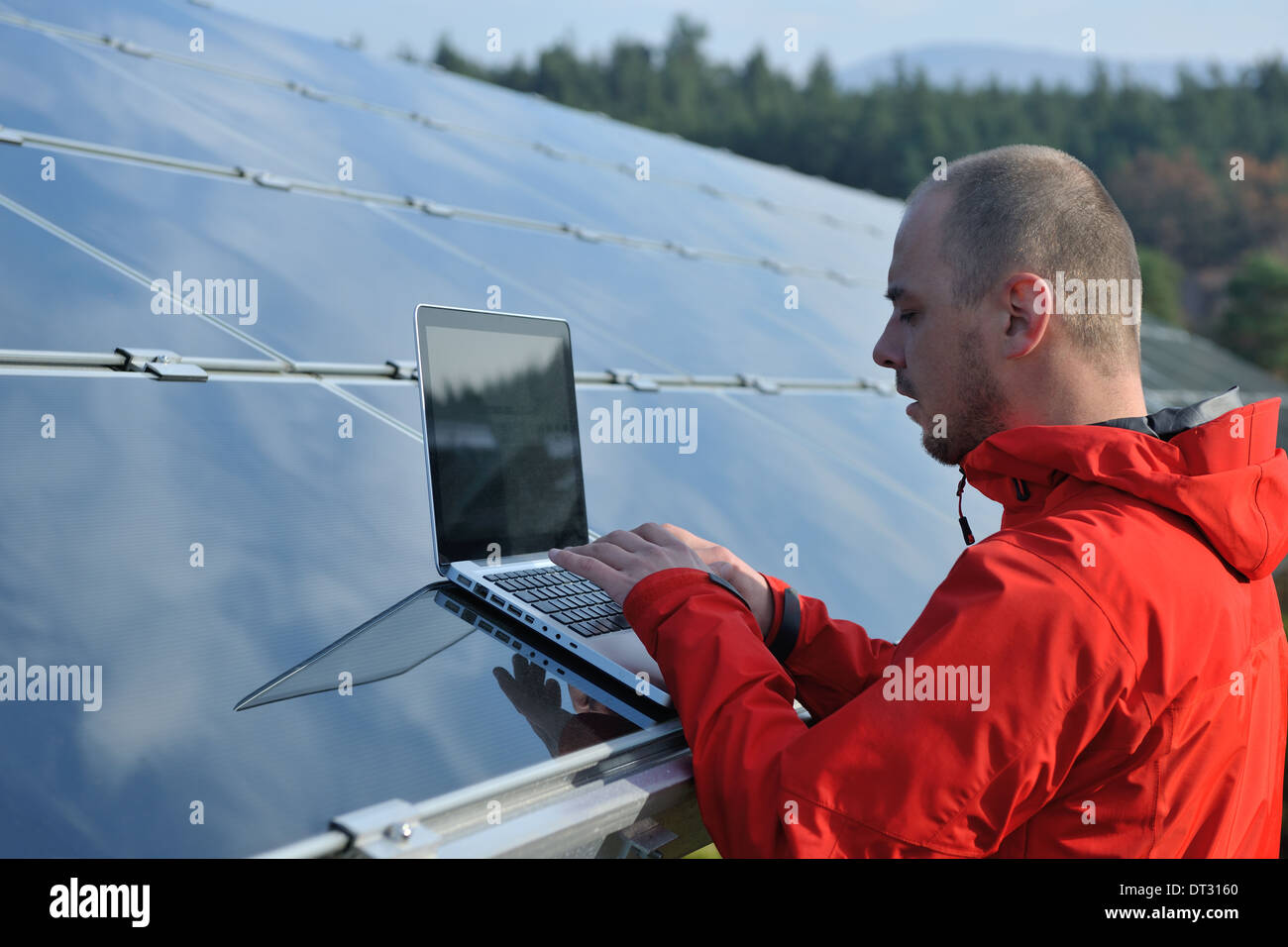 engineer using laptop at solar panels plant field Stock Photo - Alamy