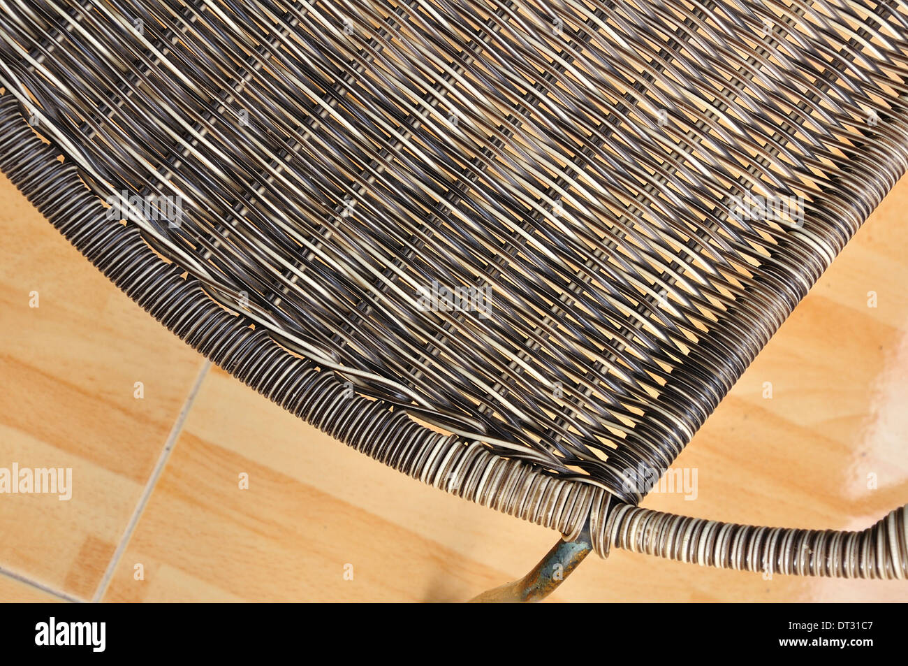 Wicker chair on a metal frame Stock Photo - Alamy