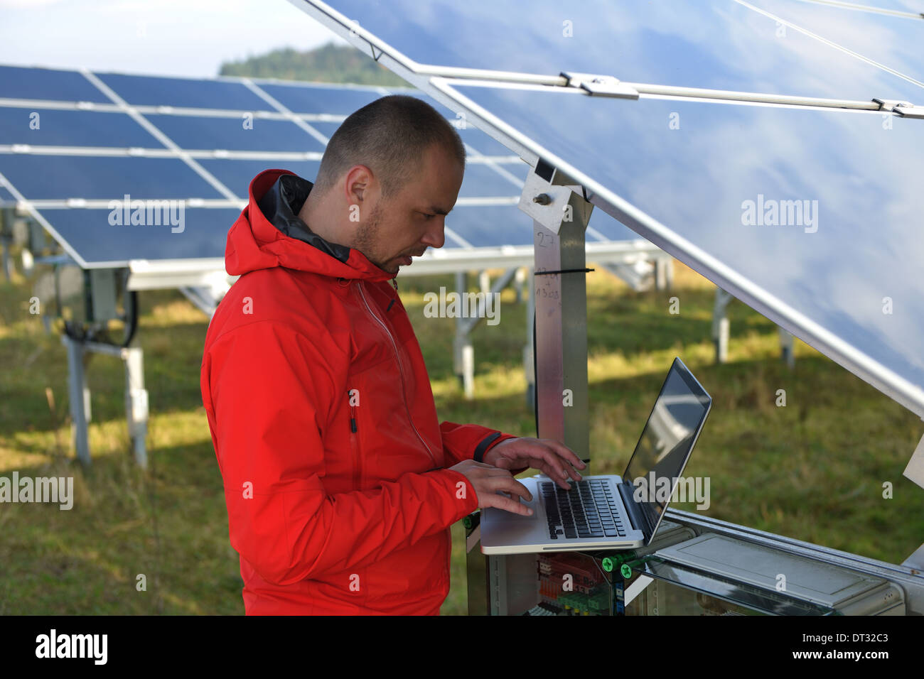 engineer using laptop at solar panels plant field Stock Photo - Alamy
