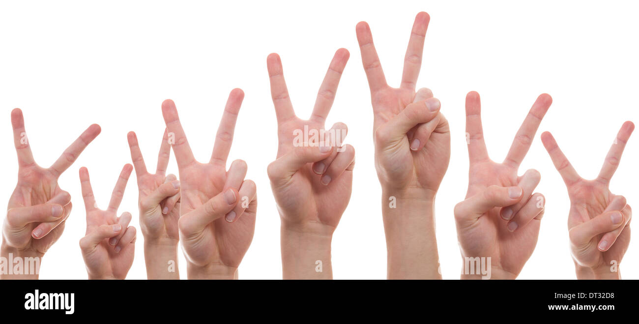 Teenagers raising their hands with two finger symbolizing peace Stock ...