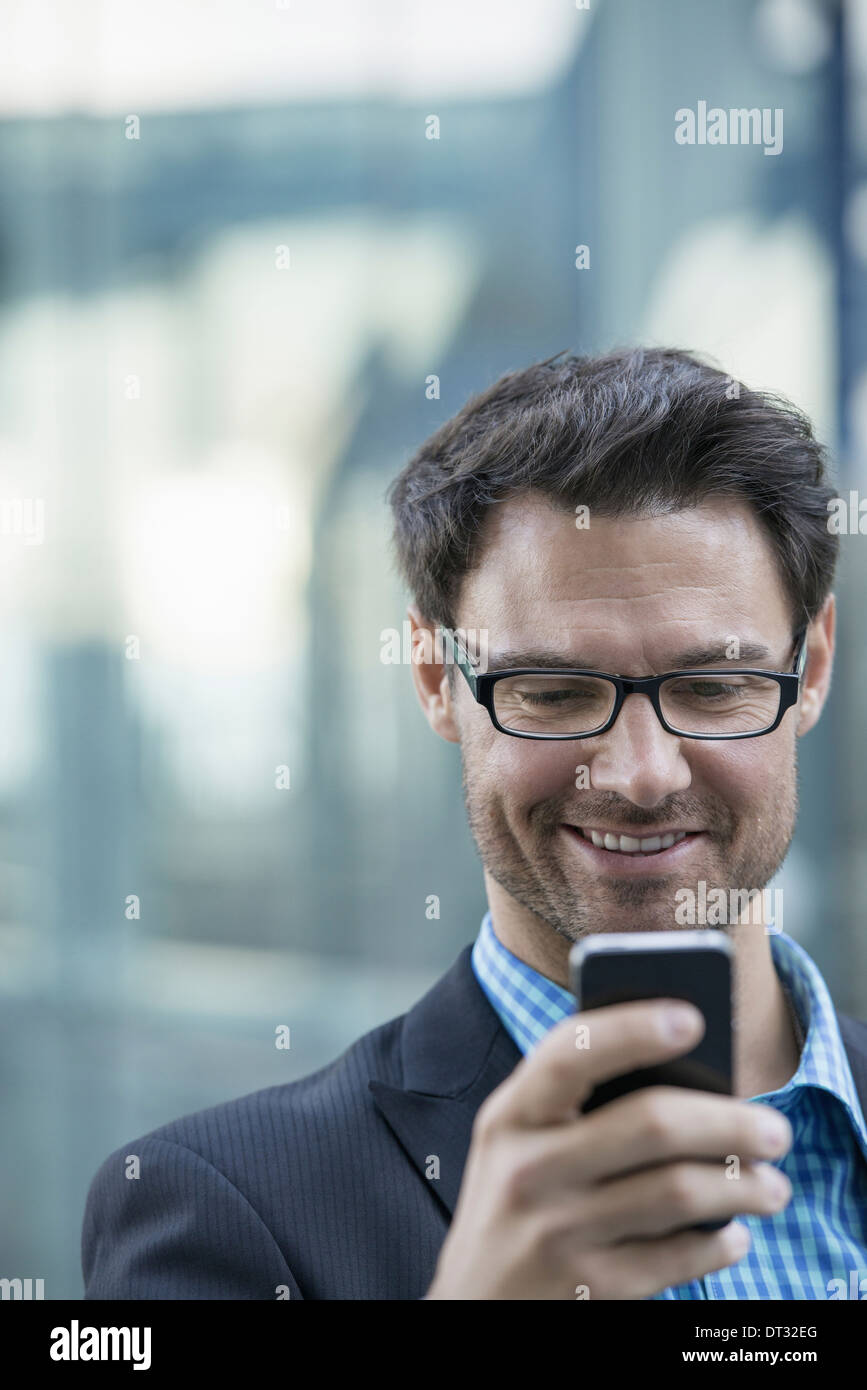 A man checking his cell phone Stock Photo - Alamy