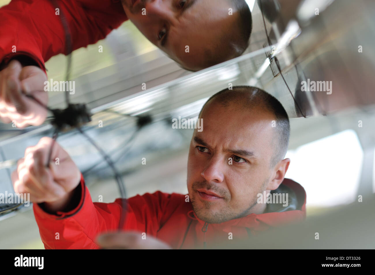 Male solar panel engineer at work place Stock Photo - Alamy