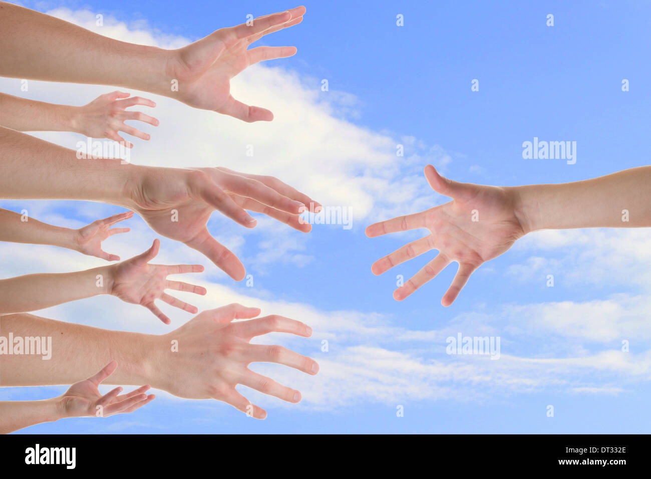 Several caucasian hands reaching for the helping hand Stock Photo - Alamy