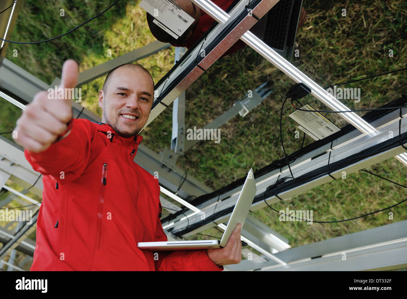 engineer using laptop at solar panels plant field Stock Photo - Alamy