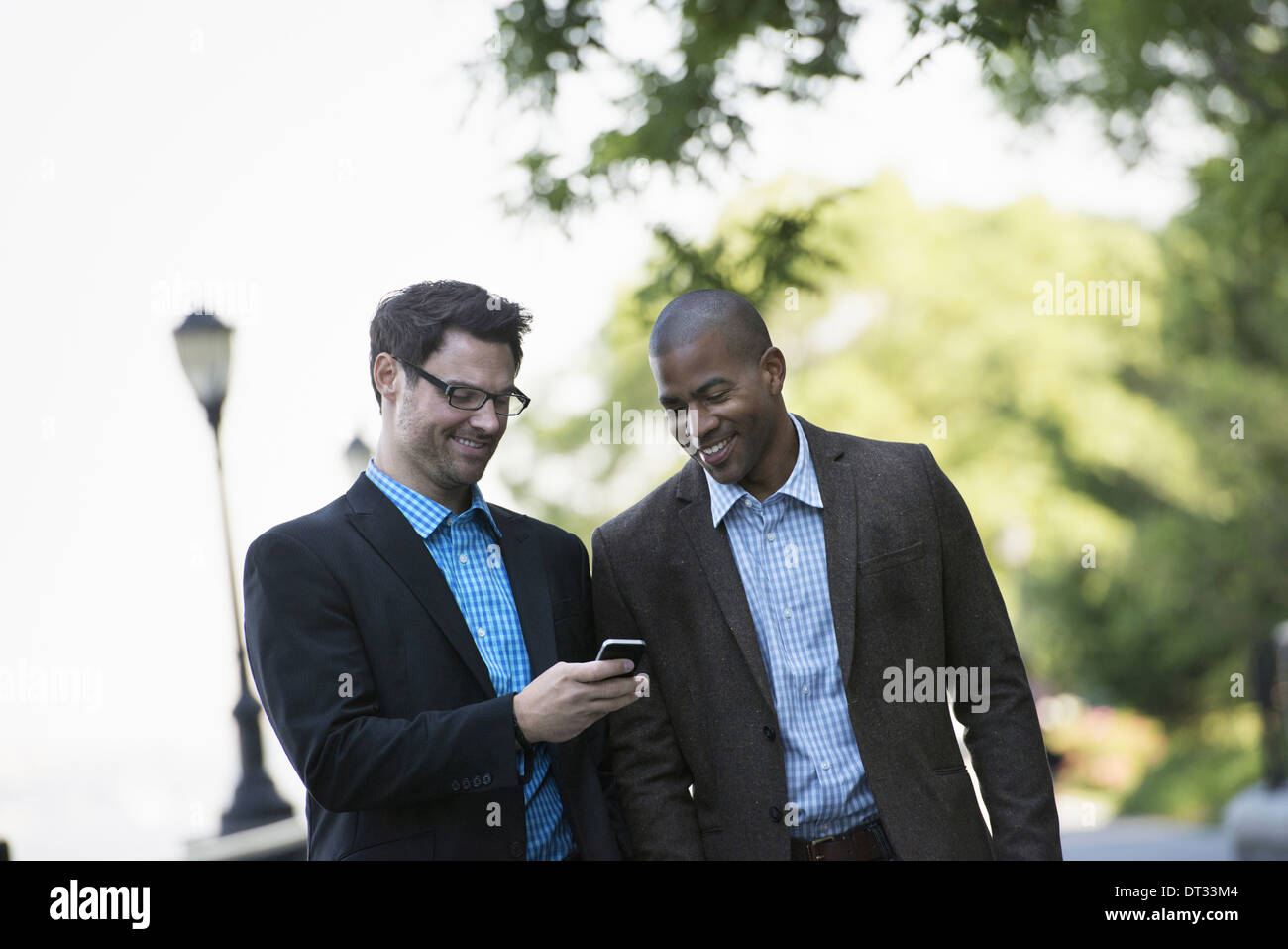 Two men walking hi-res stock photography and images - Alamy