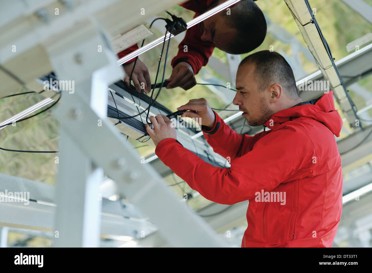 Male solar panel engineer at work place Stock Photo - Alamy
