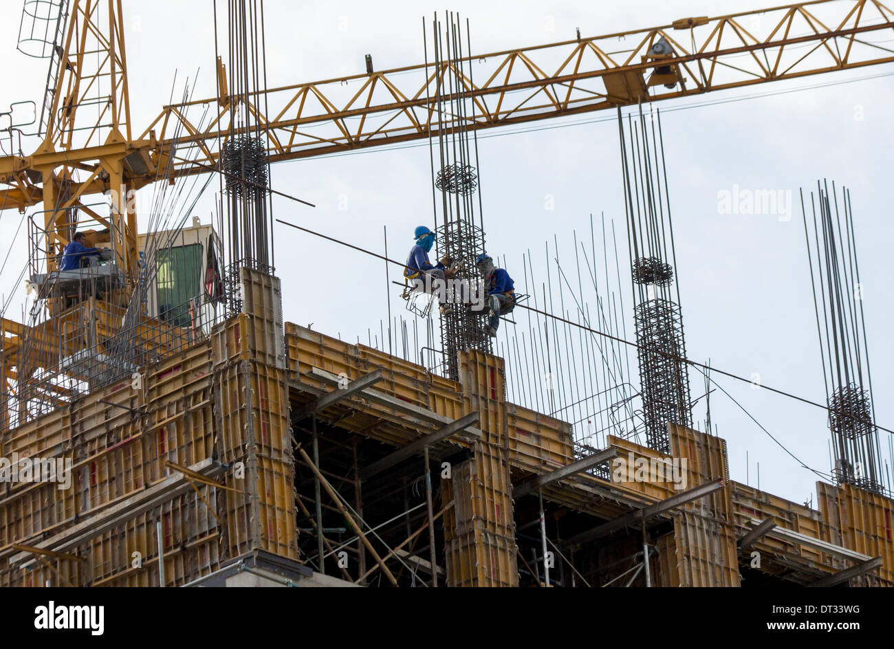 Metro Manila, Philippines: February 7, 2014 -Workers check the steel ...