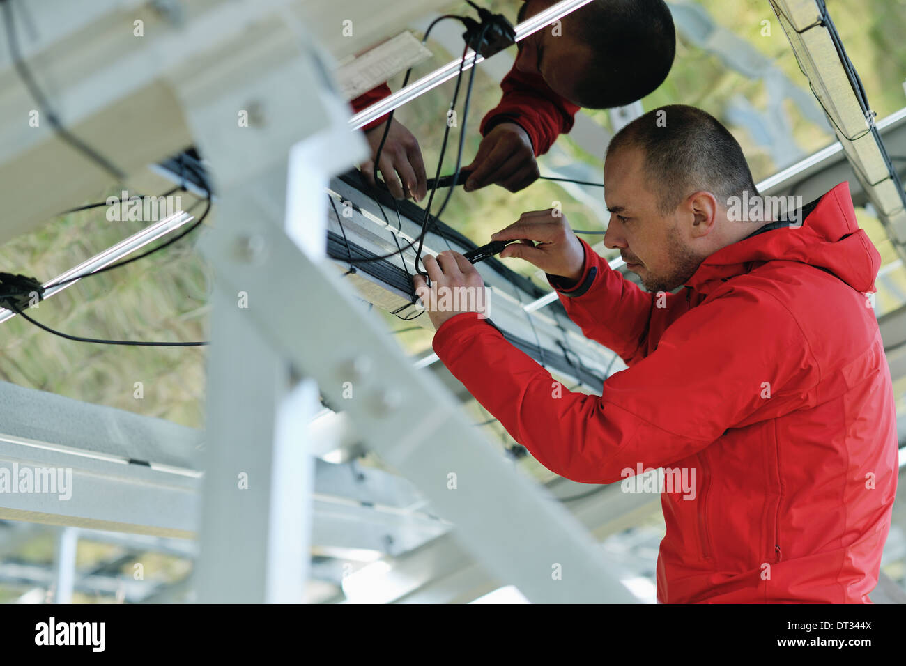 Male solar panel engineer at work place Stock Photo - Alamy