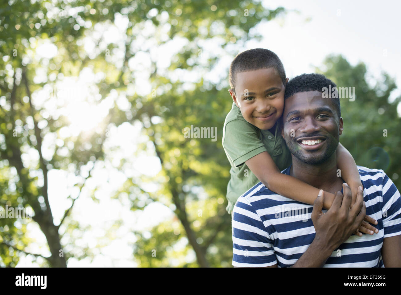 Child on piggyback hi-res stock photography and images - Alamy