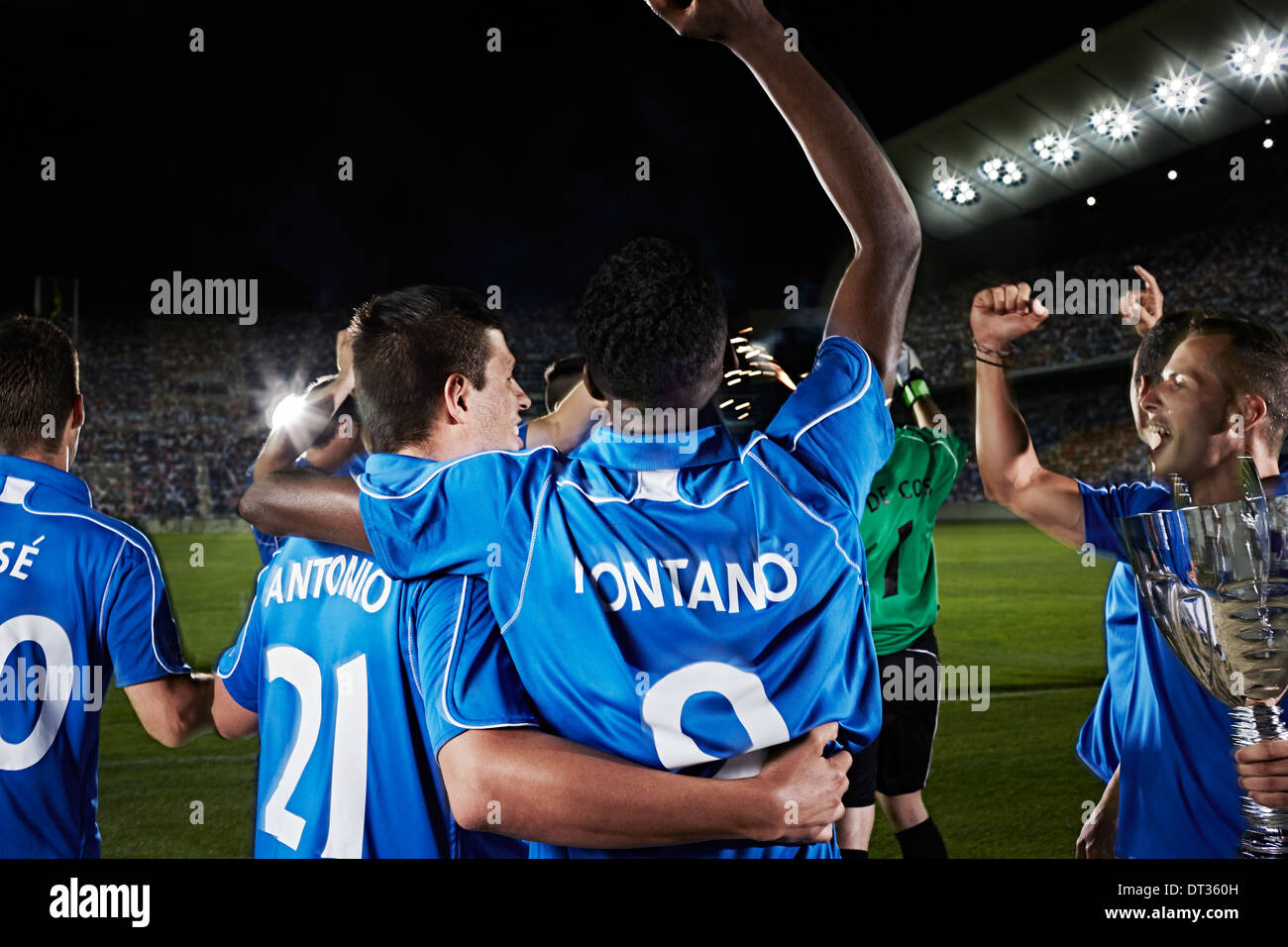 Soccer team cheering on field Stock Photo - Alamy