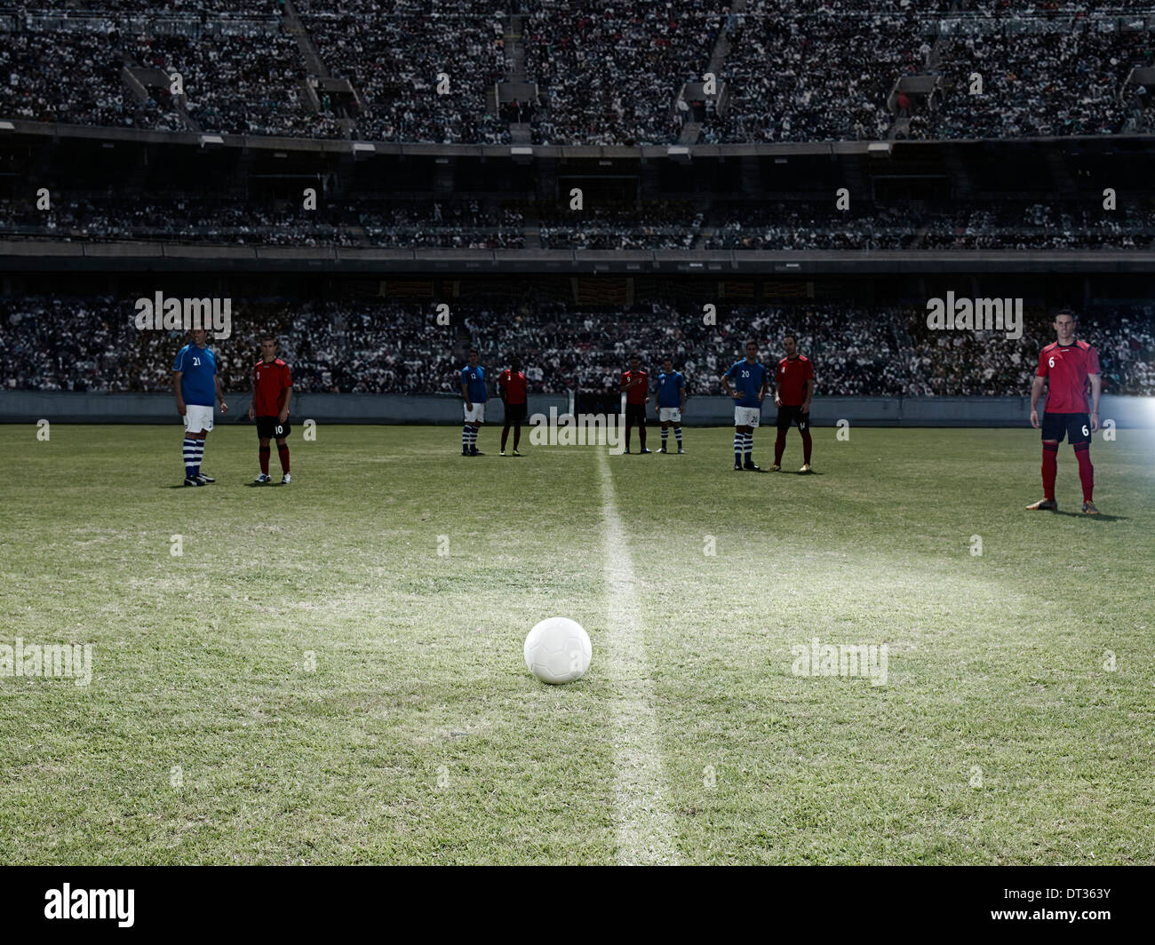 Soccer ball sitting on field Stock Photo - Alamy