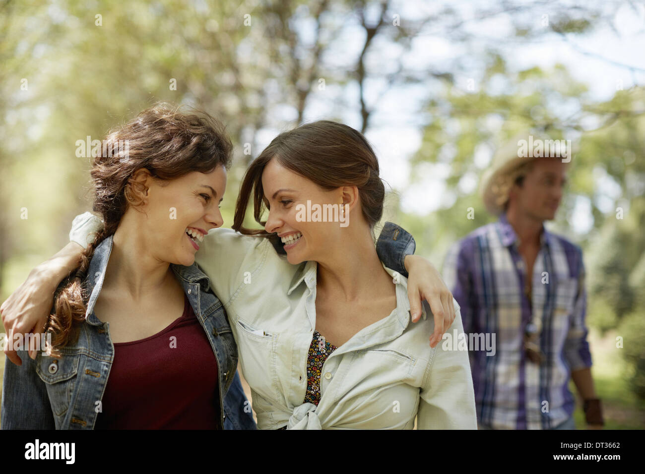 Two friends smiling at each other Stock Photo - Alamy