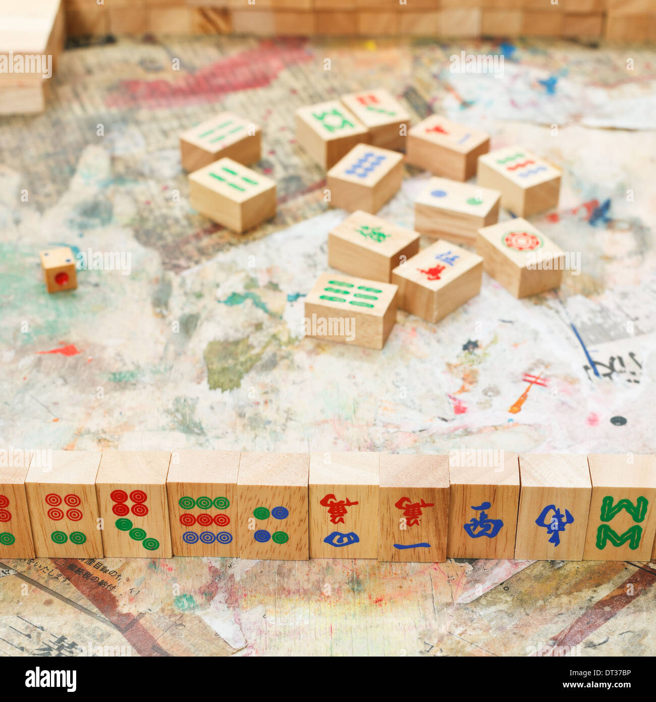 wood tiles on player hand in mahjong game durung playing round Stock ...