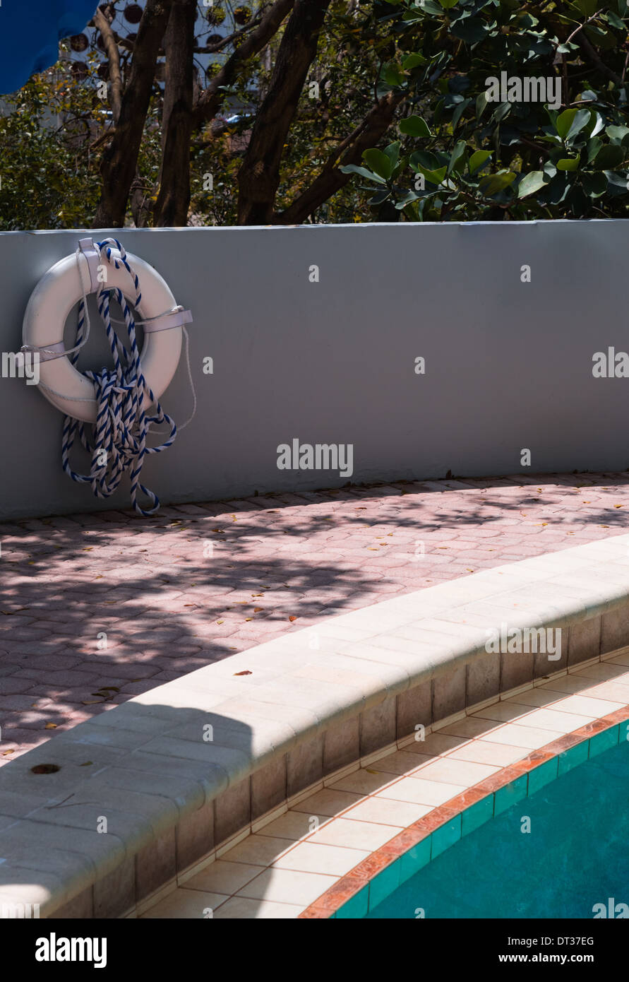 Fun and safety; swimming pool, patio and floating ring Stock Photo - Alamy