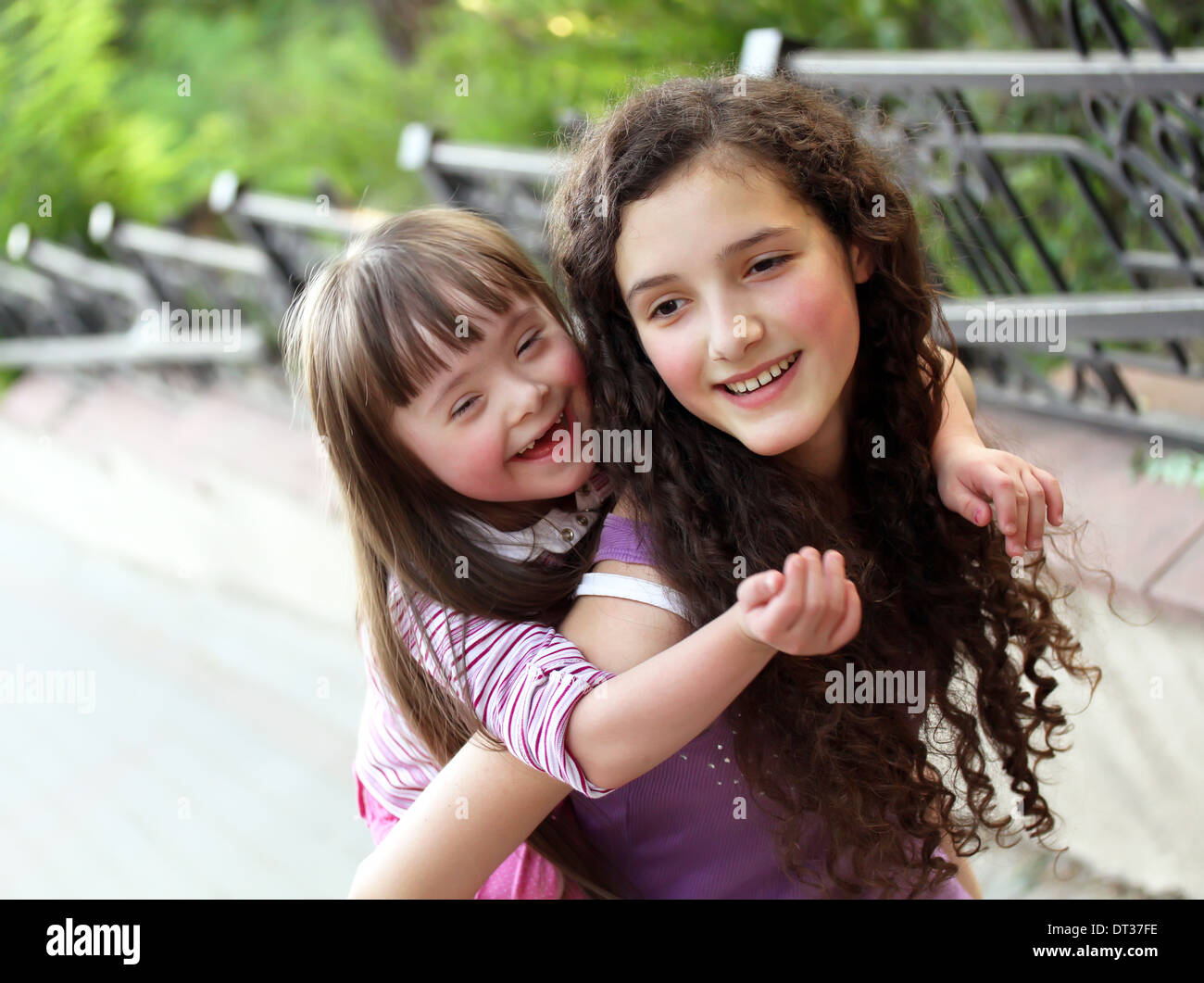 Happy girls in the park Stock Photo - Alamy