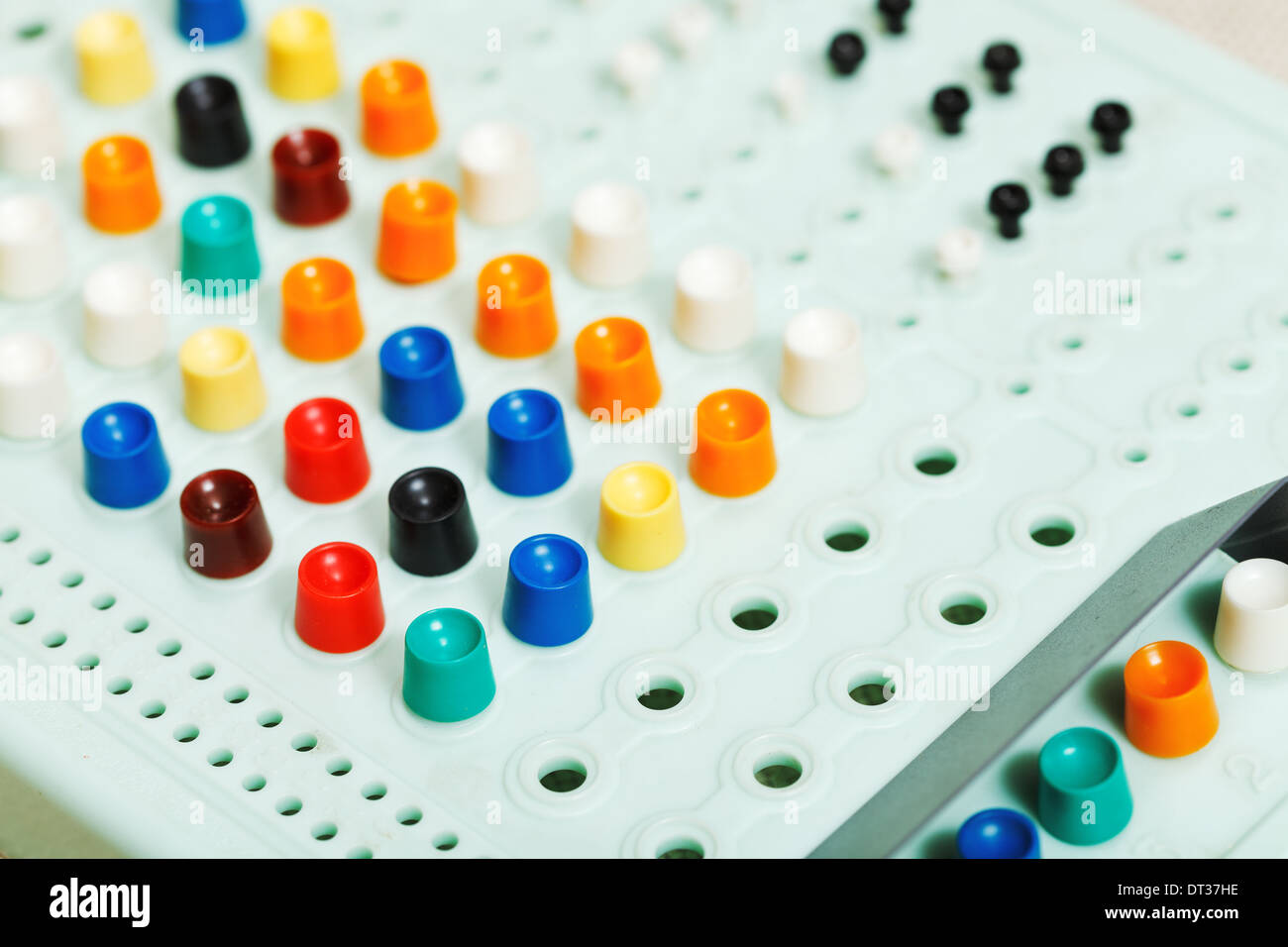 playing in logical board game - guess code Stock Photo - Alamy