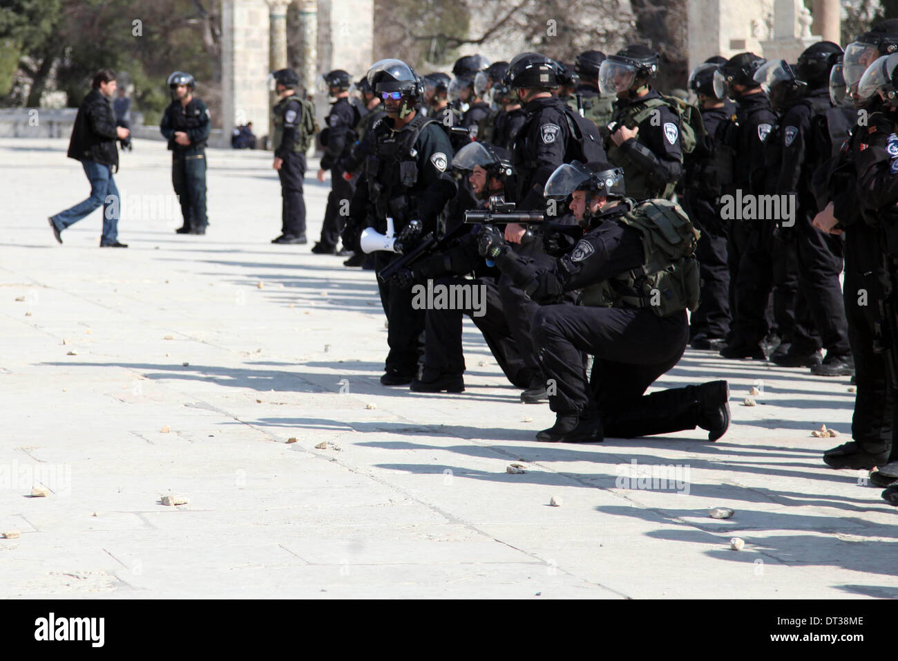 Israeli policeman aims his rubber bullet launcher during clashes with ...