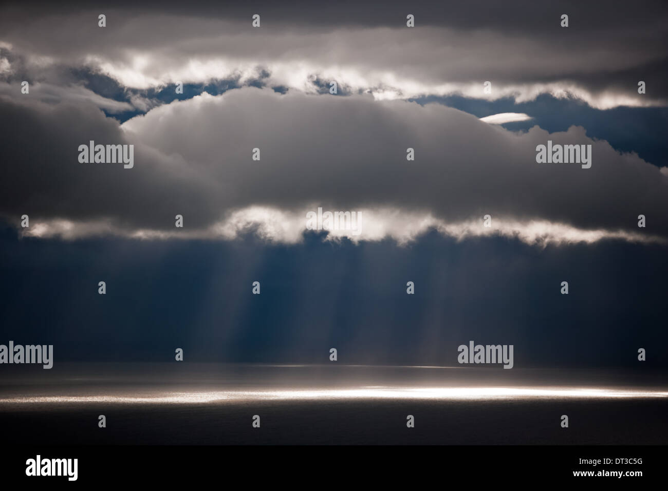 Sun rays stream down thru clouds, Kamai National Park, Alaska, USA ...