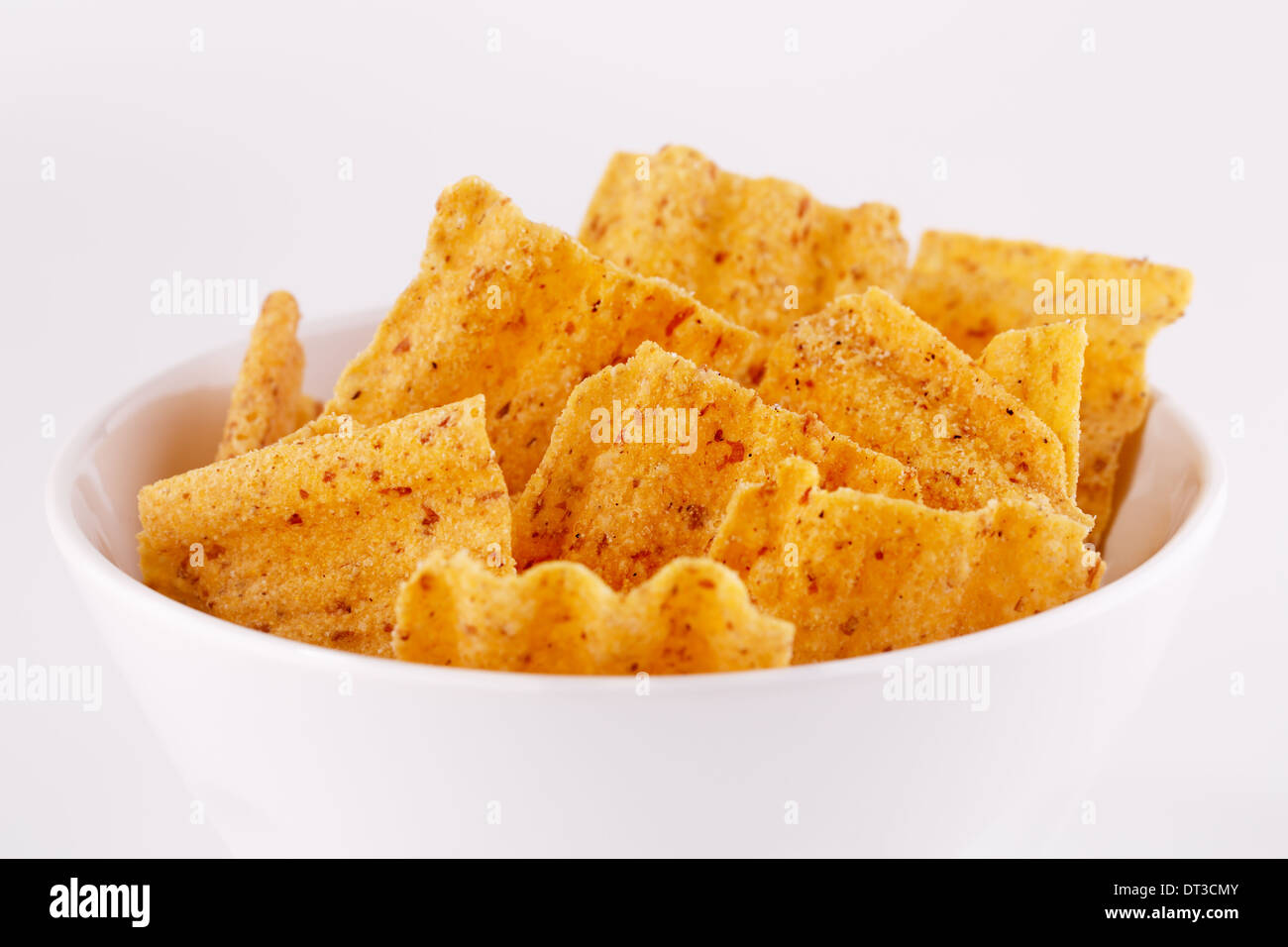 Wheat chips in bowl isolated on gray background Stock Photo - Alamy