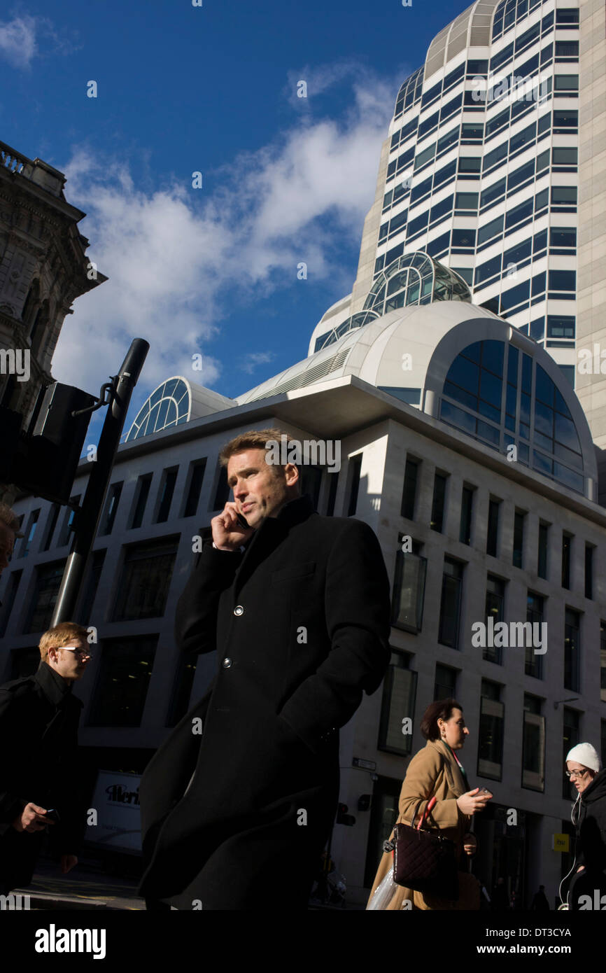 Strangers walking in City of London street with banking offices ...