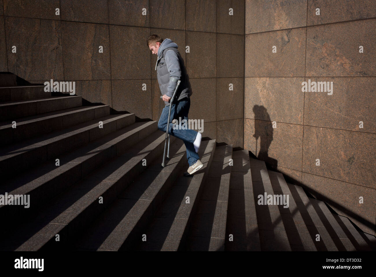 One legged man on crutches hi-res stock photography and images - Alamy