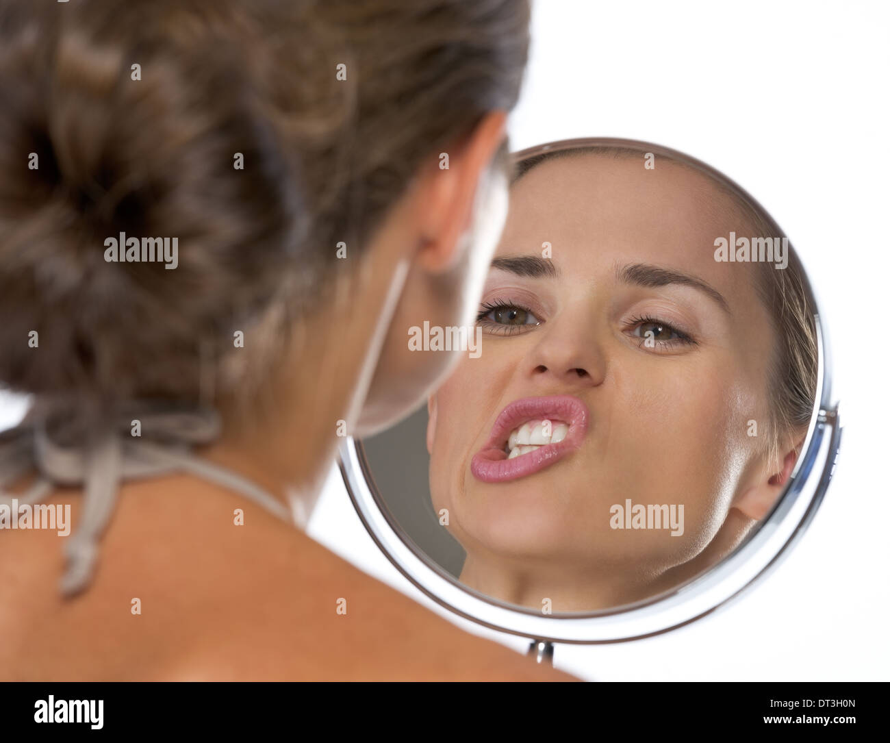 Woman making faces, mirror hi-res stock photography and images - Alamy