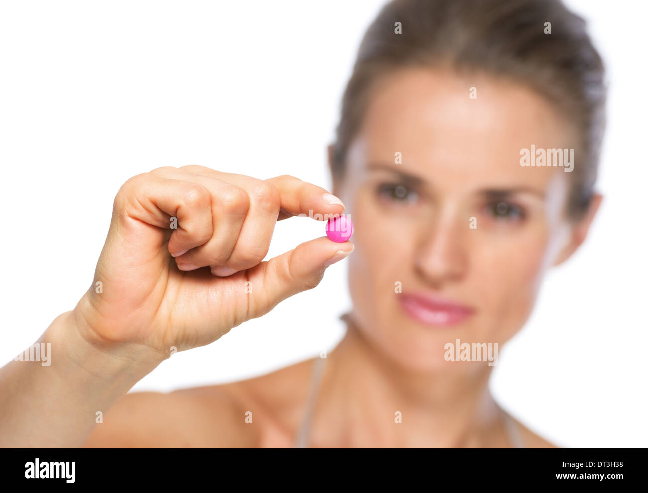 Closeup on young woman showing pill Stock Photo - Alamy
