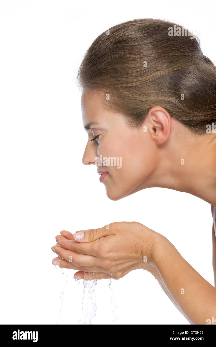 Young woman washing face Stock Photo - Alamy