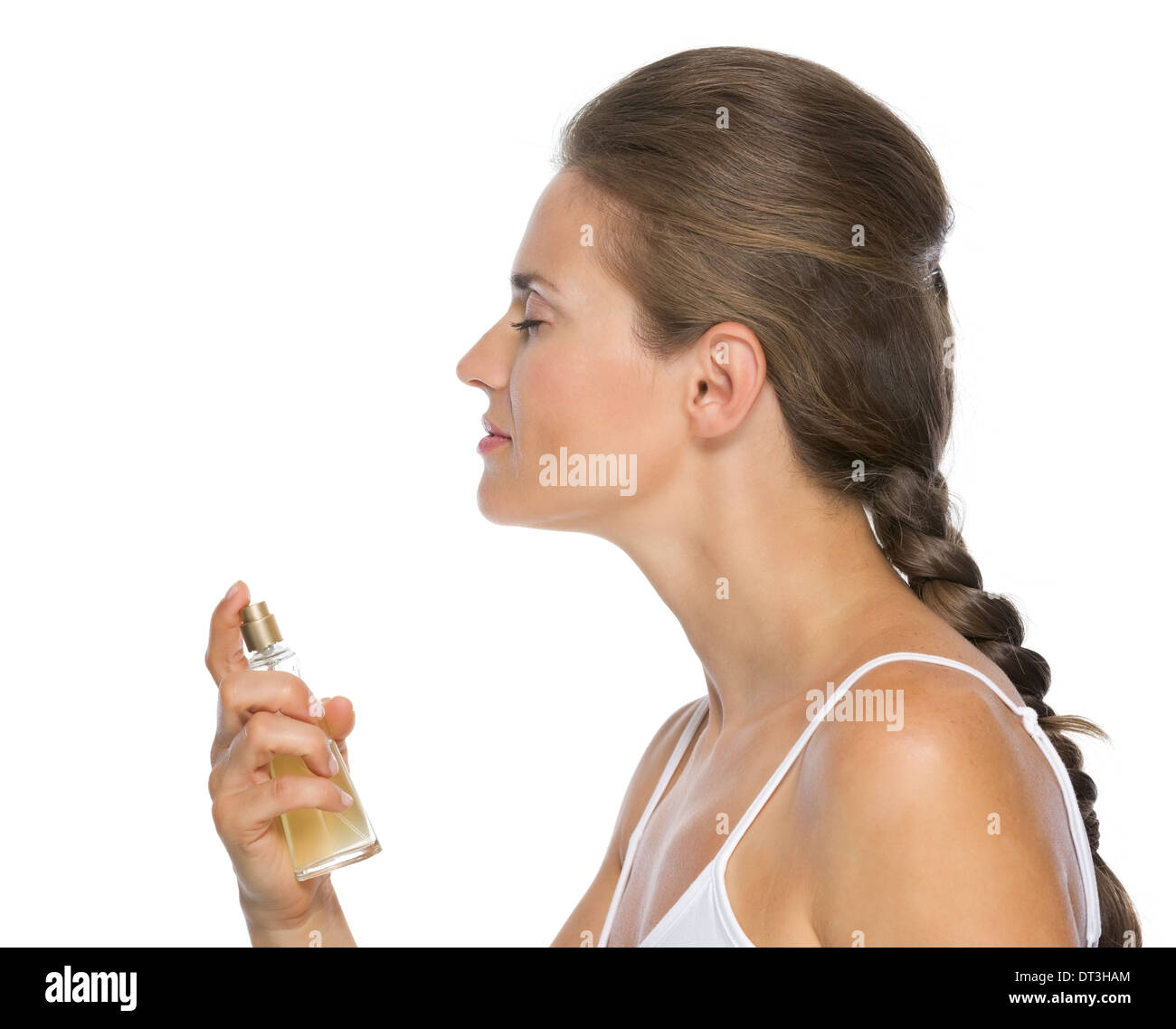 Profile portrait of young woman applying perfume Stock Photo - Alamy