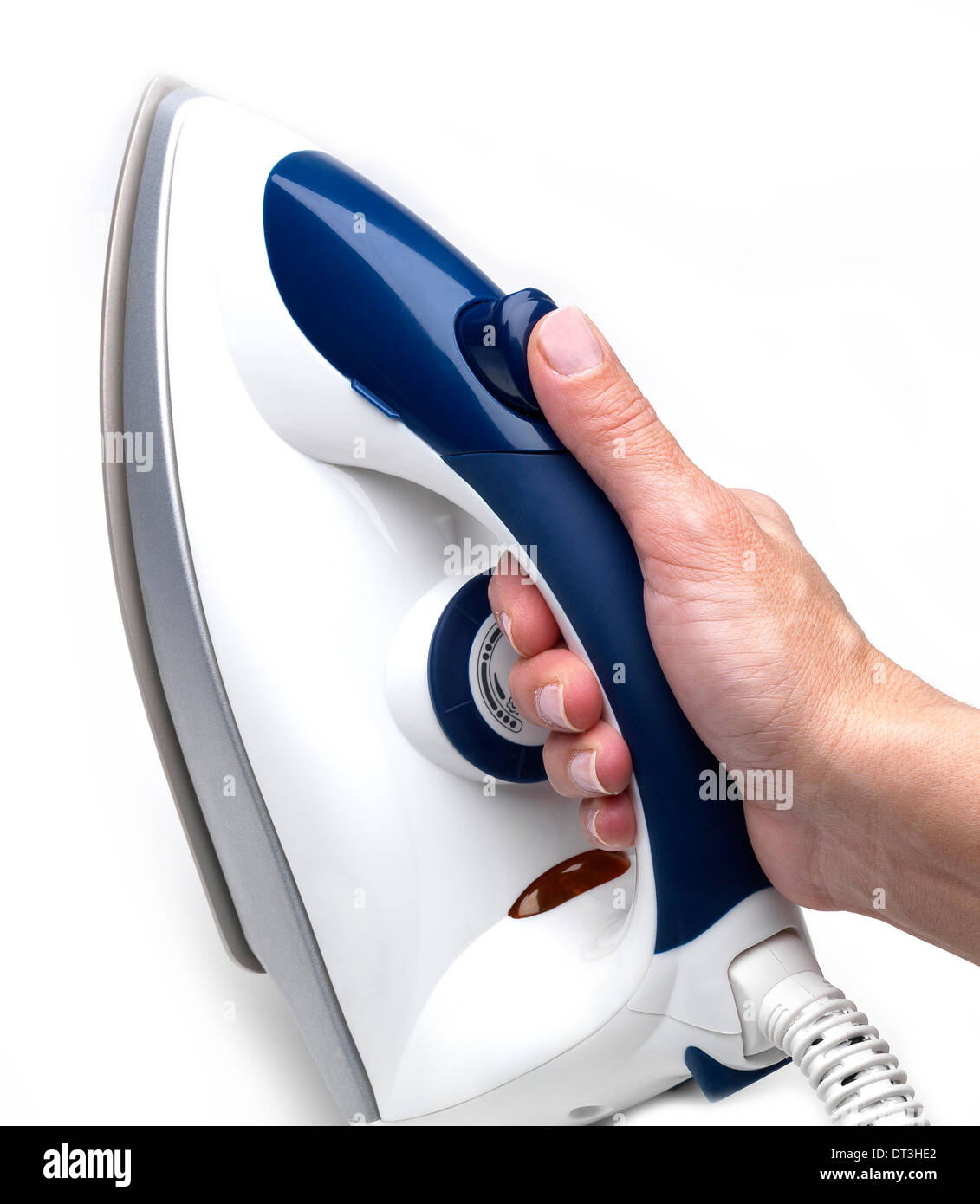 female hand pressing the steam button of a flat iron Stock Photo - Alamy