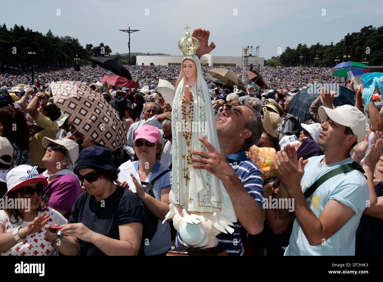 Pilgrim hold the statue during the procession of Fatima in central ...