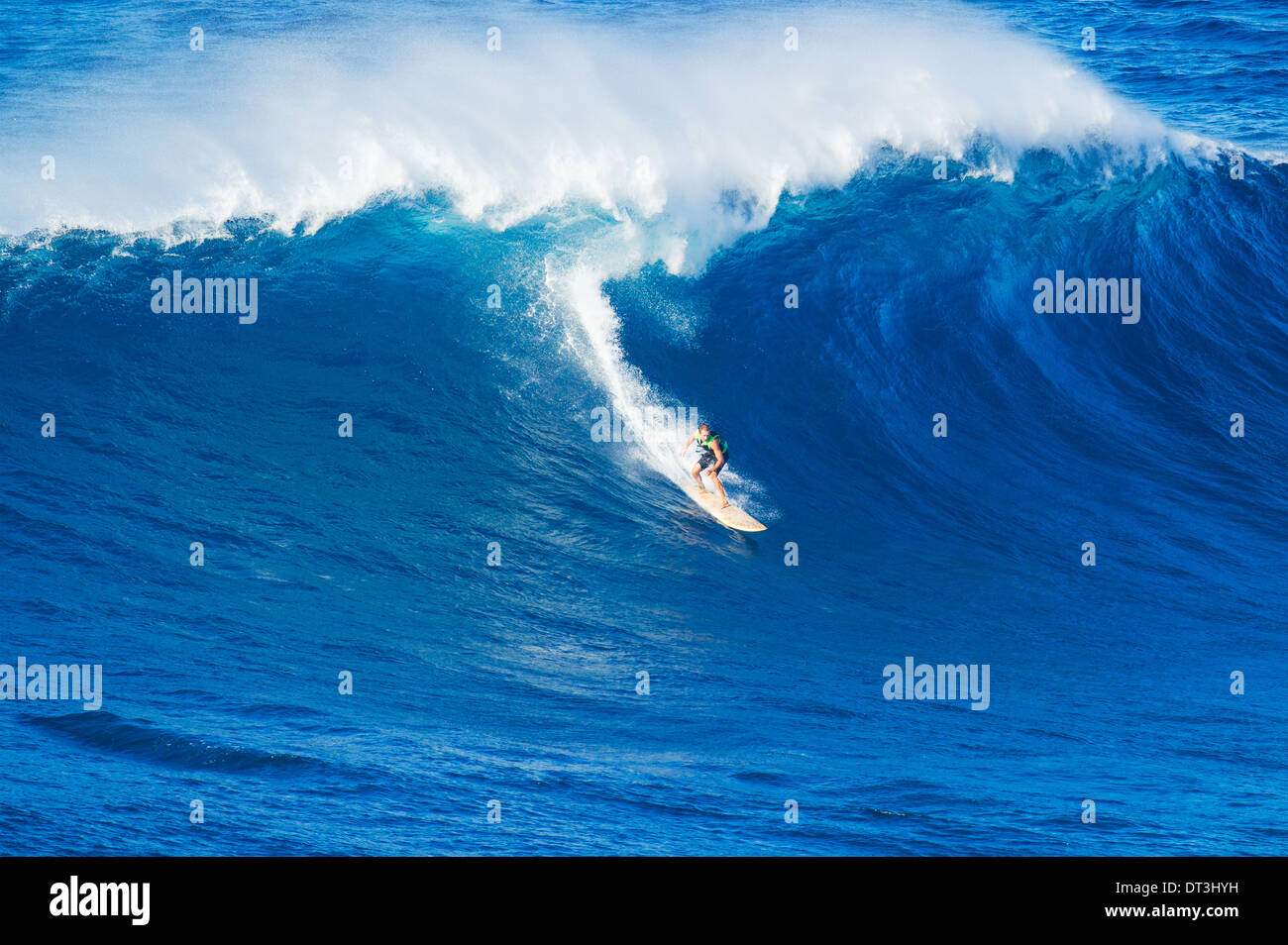 Extreme surfer riding giant wave Stock Photo - Alamy