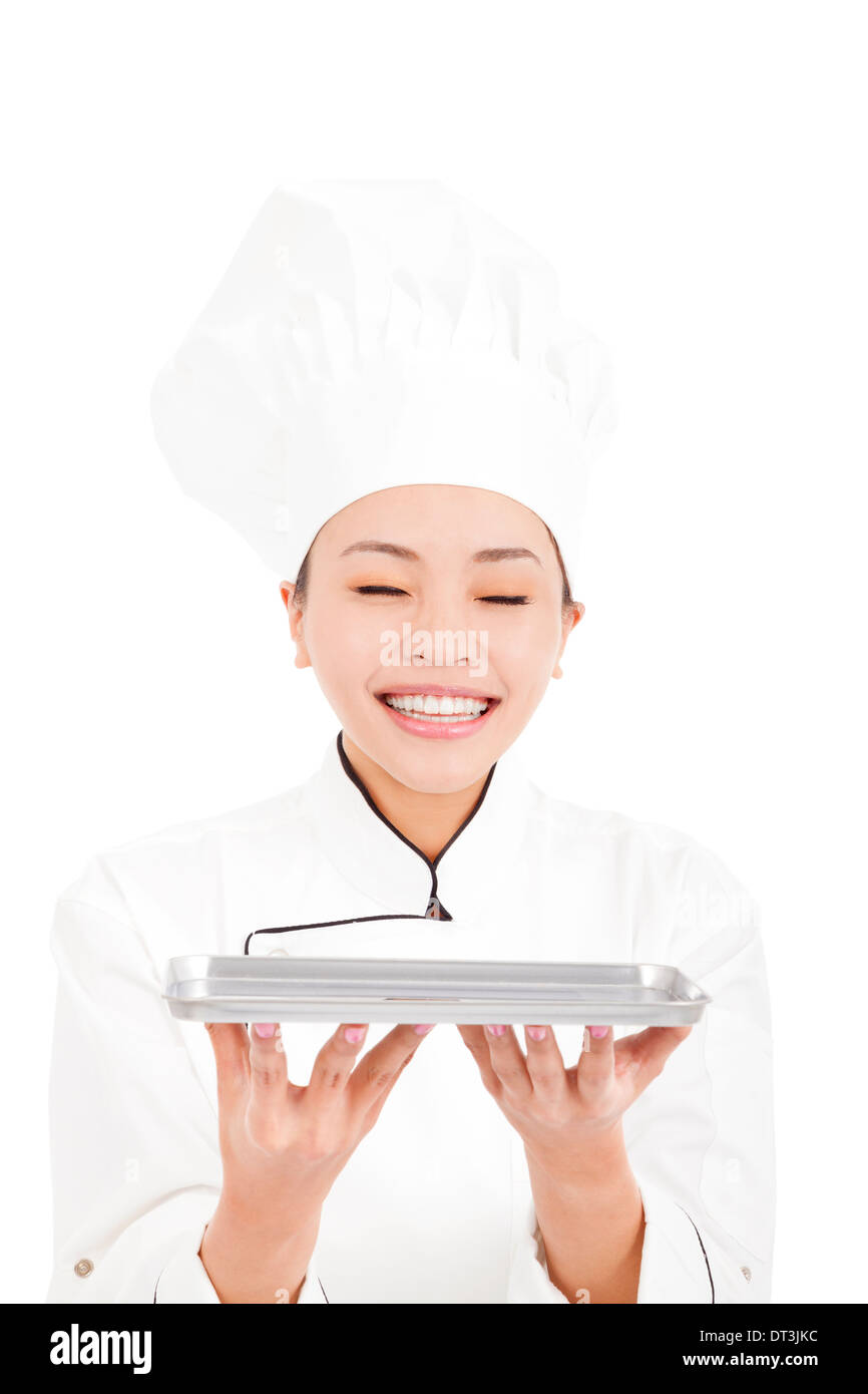 pretty woman chef smell something on tray on white Stock Photo - Alamy