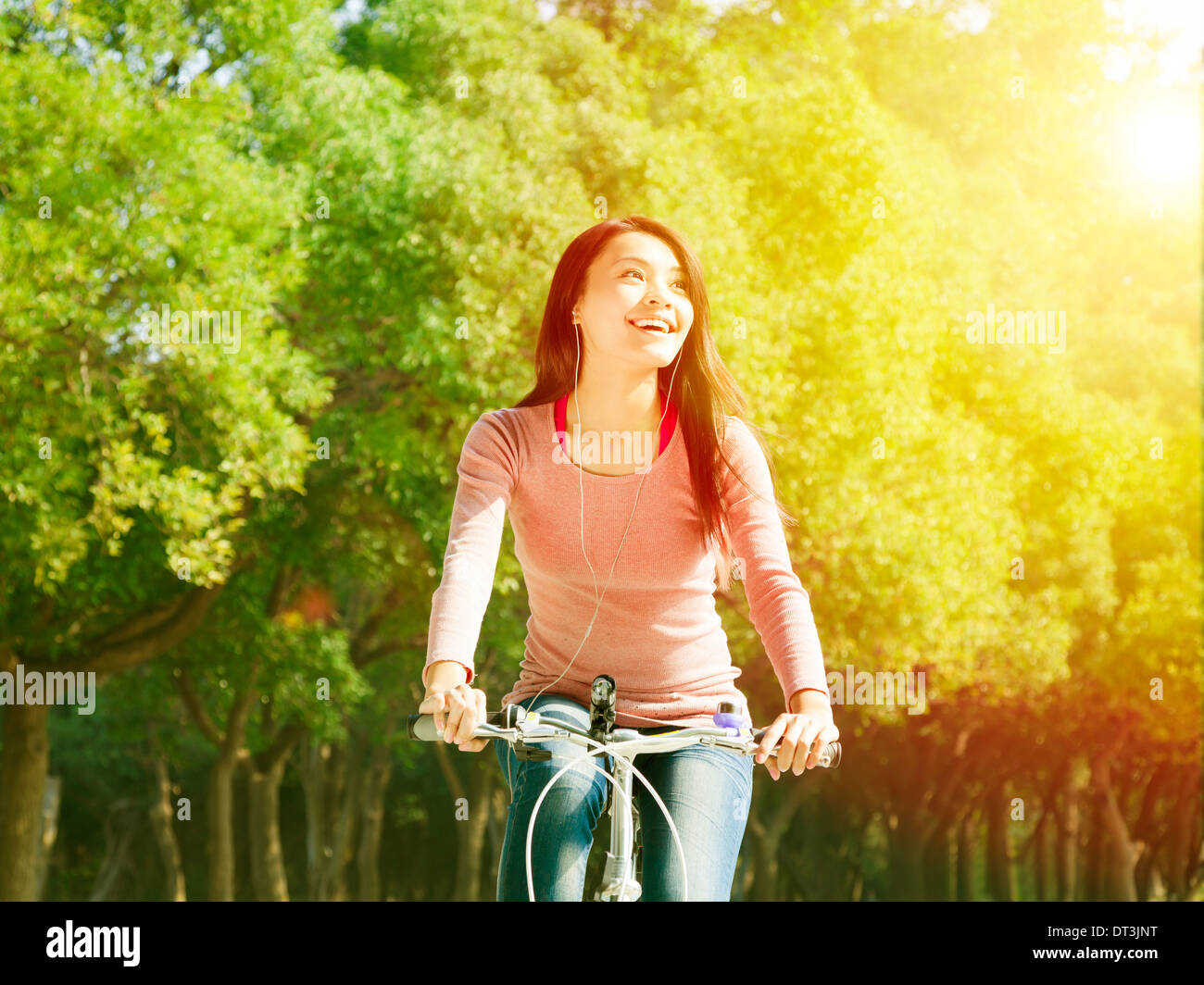 Woman bike sun hi-res stock photography and images - Alamy