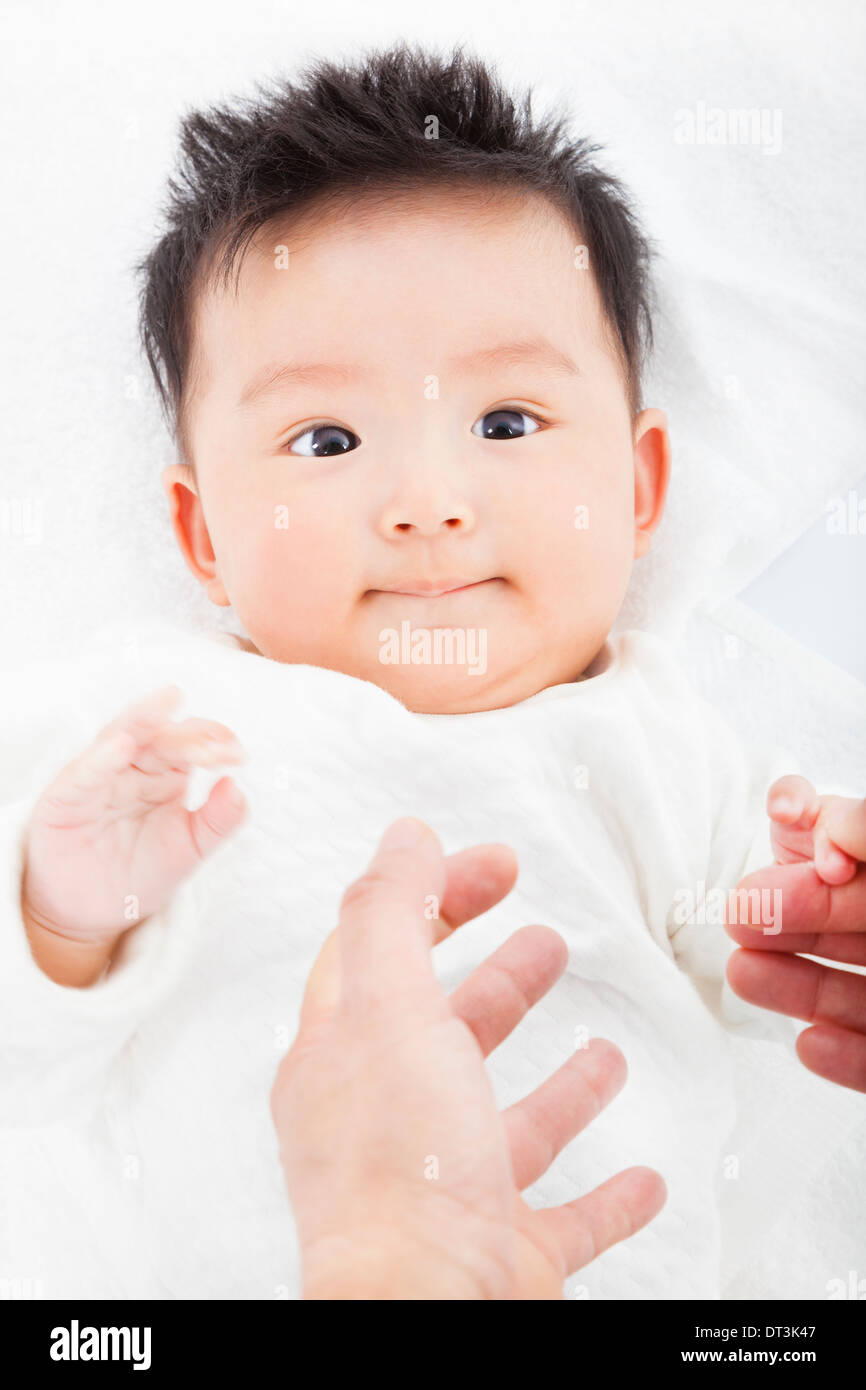asian cute and smiling infant with mother hands Stock Photo - Alamy