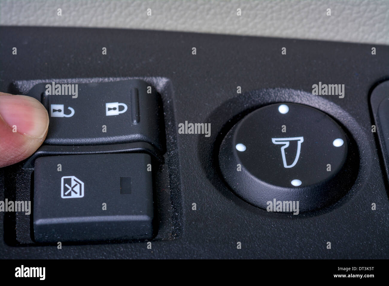 Button is pressed to open car window Stock Photo - Alamy