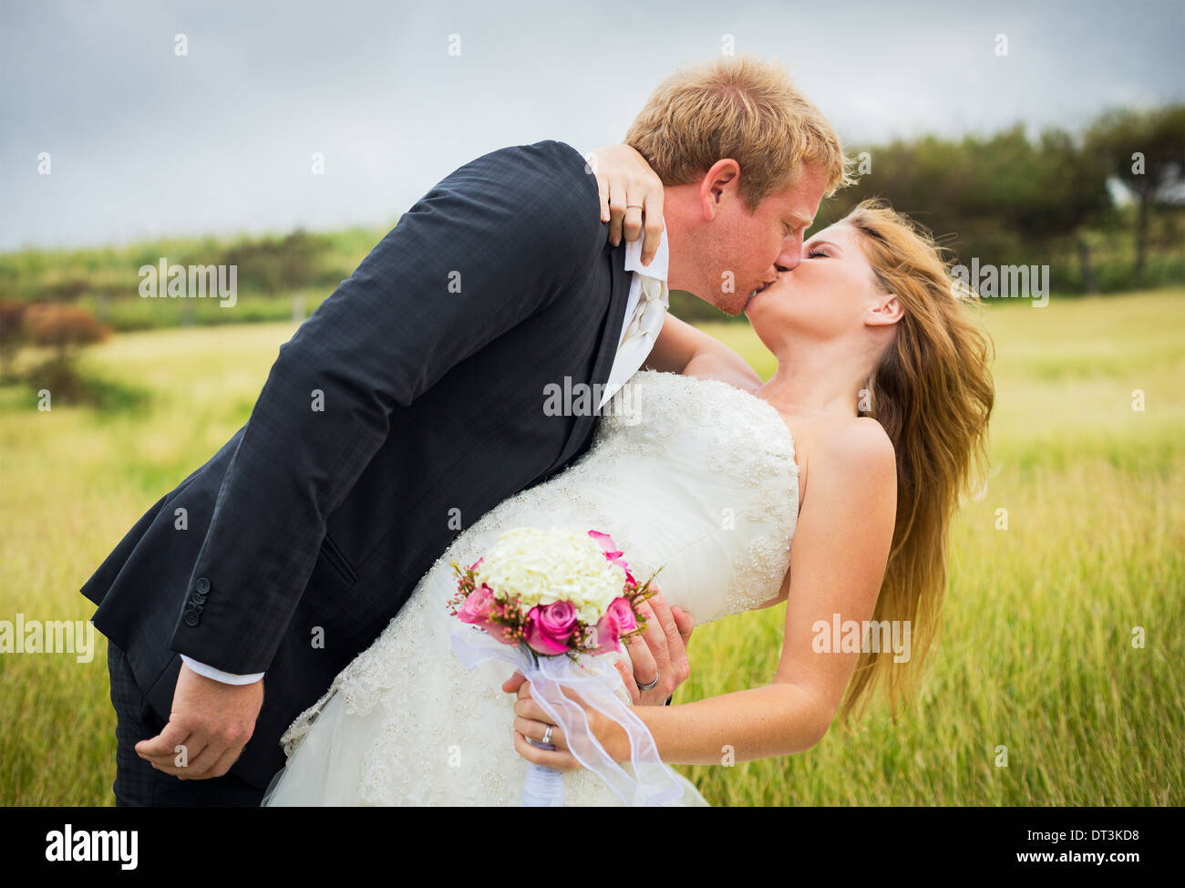 Wedding Couple, Happy romantic bride and groom kissing Stock Photo - Alamy