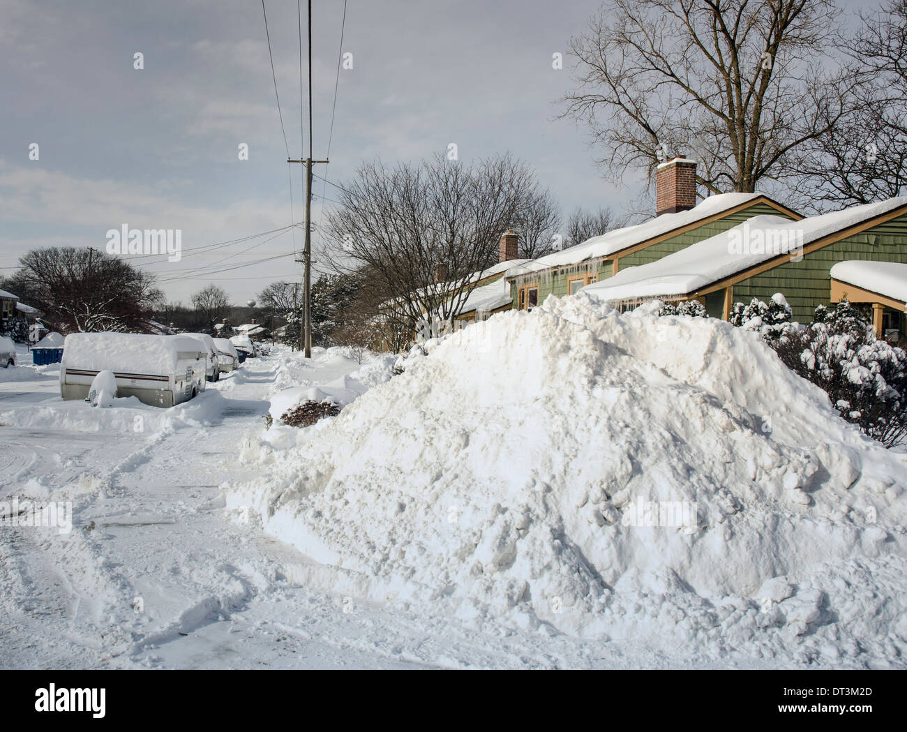 Snow piled up almost hides houses Stock Photo - Alamy