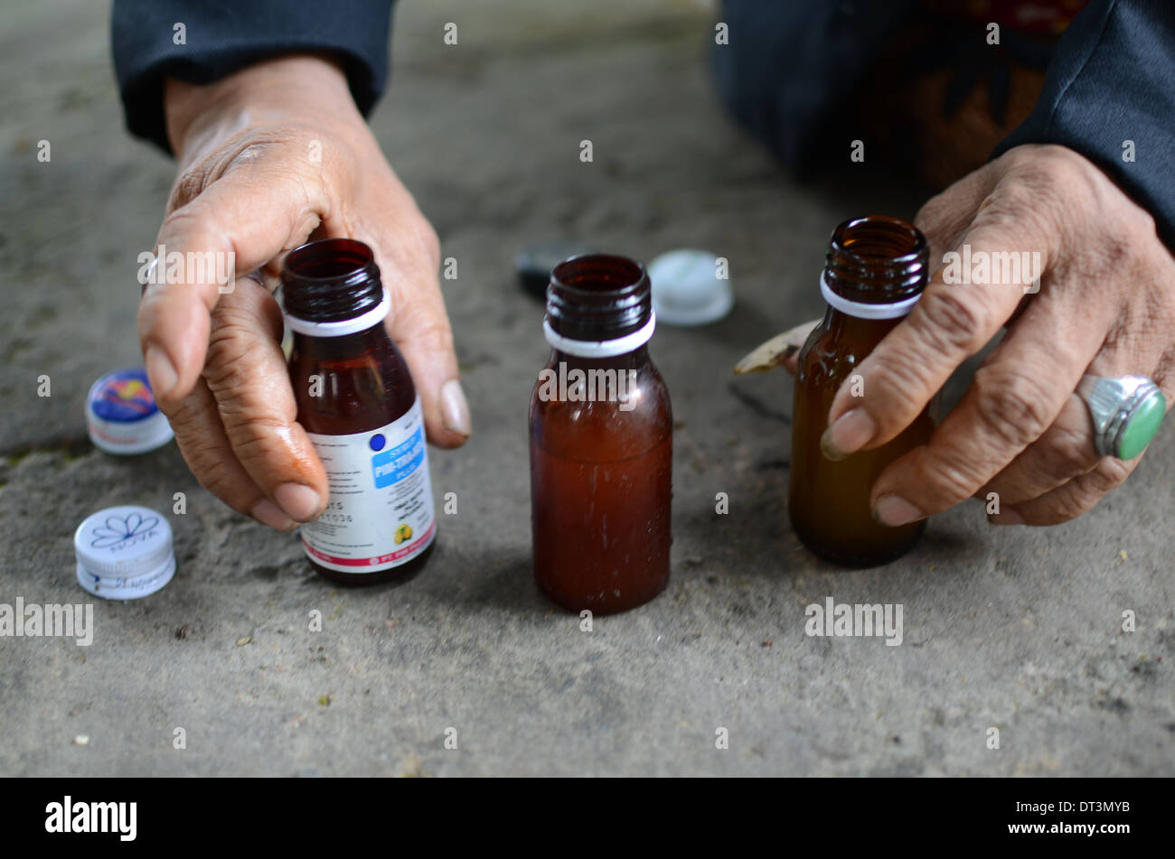 Traditional liquor called Badek contained in bottles at the tomb of ...