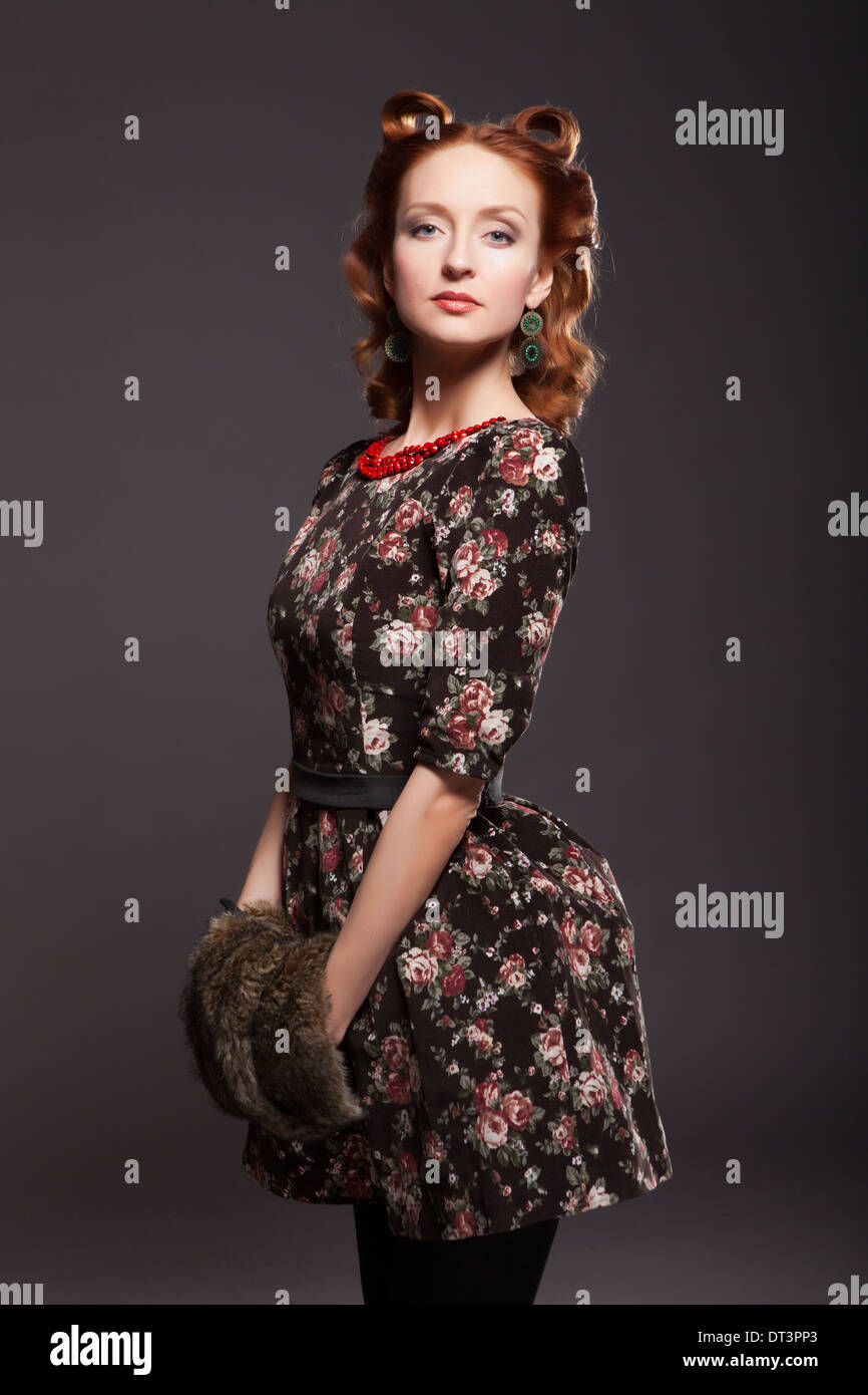 Girl in retro style posing with fur things Stock Photo - Alamy