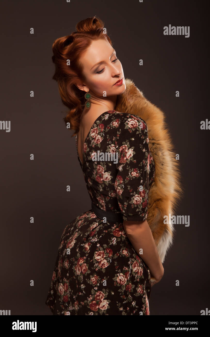Girl in retro style posing with fur things Stock Photo - Alamy