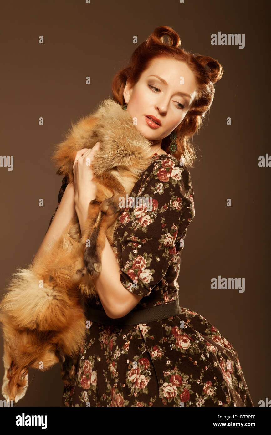 Girl in retro style posing with fur things Stock Photo - Alamy