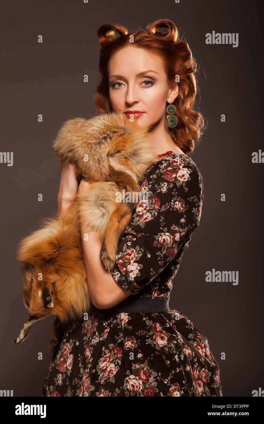 Girl in retro style posing with fur things Stock Photo - Alamy