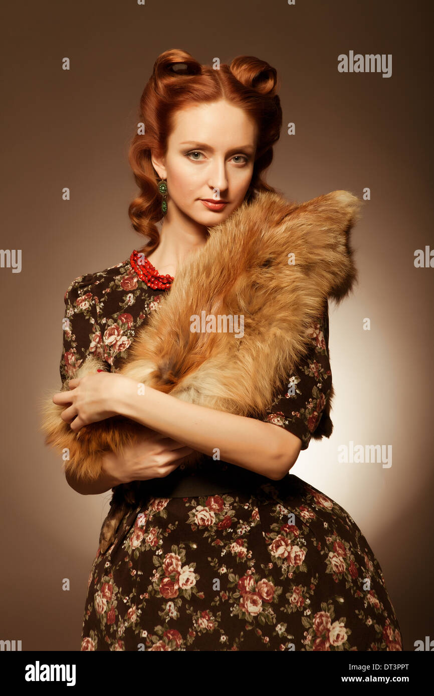 Girl in retro style posing with fur things Stock Photo - Alamy