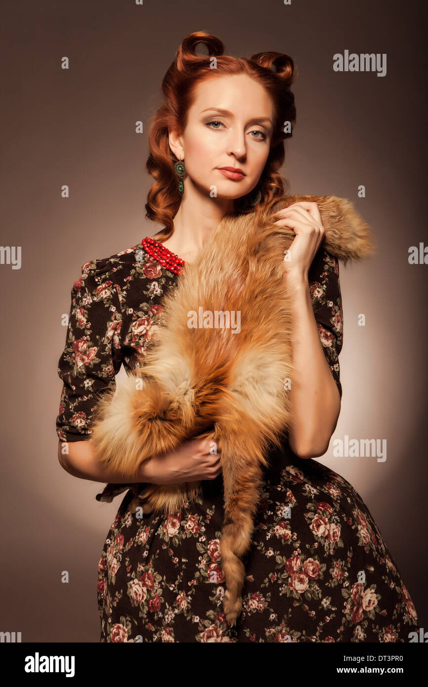 Girl in retro style posing with fur things Stock Photo - Alamy