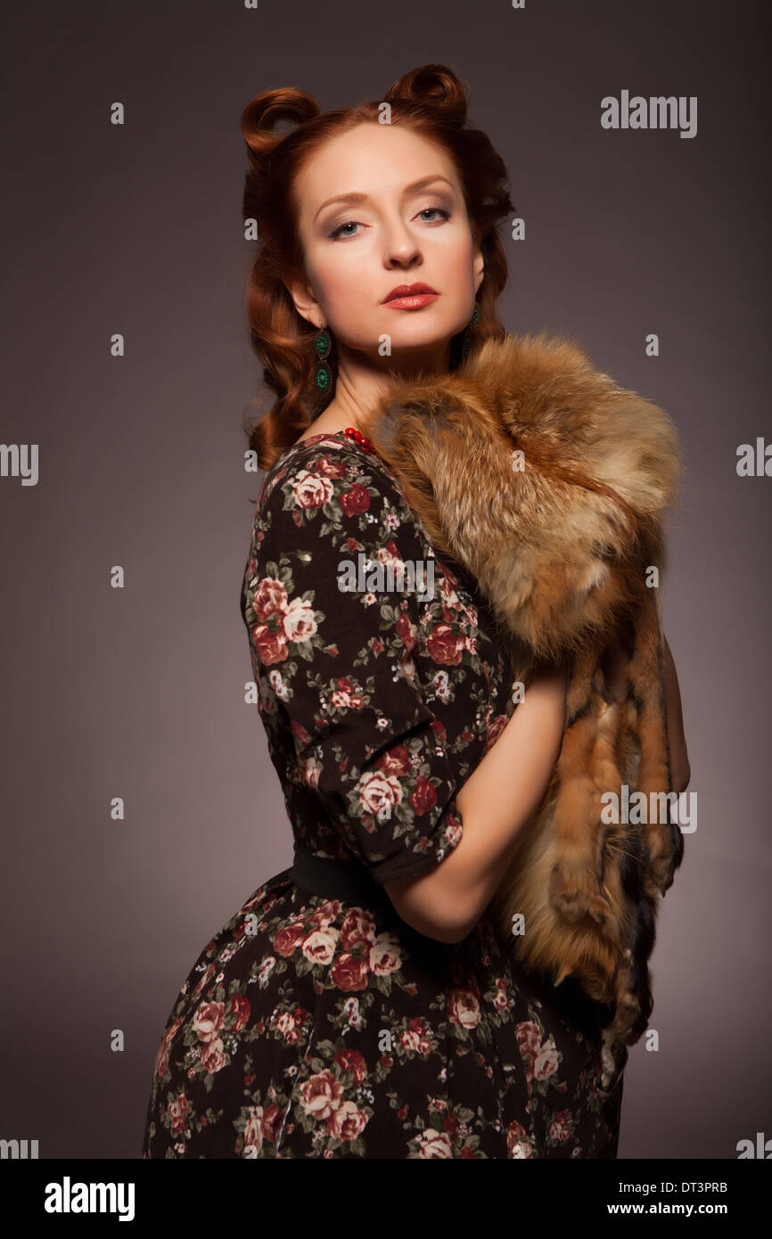 Girl in retro style posing with fur things Stock Photo - Alamy