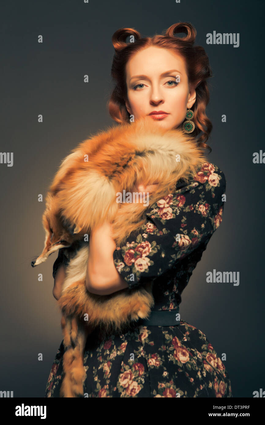 Girl in retro style posing with fur things Stock Photo - Alamy